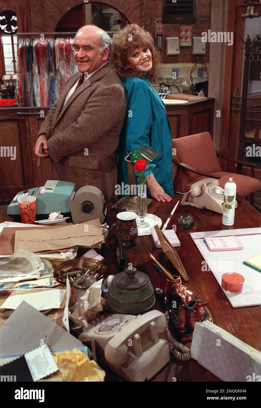 Actor Ed Asner and actress Eileen Brennan pose back to back on the set ...