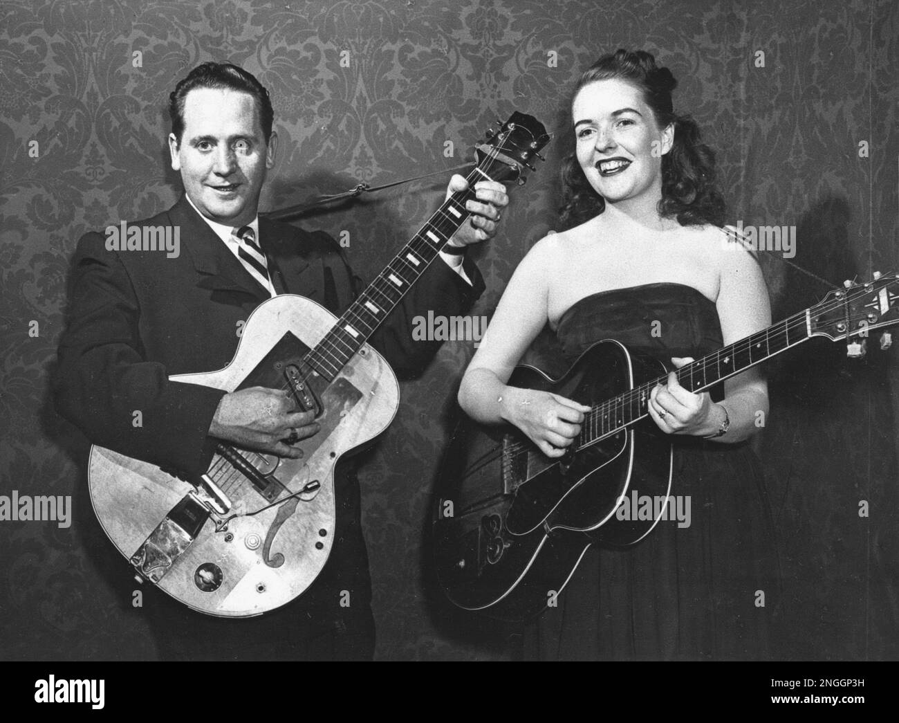 Les Paul and his wife, Mary Ford, strum their guitars on Nov. 5, 1951 ...