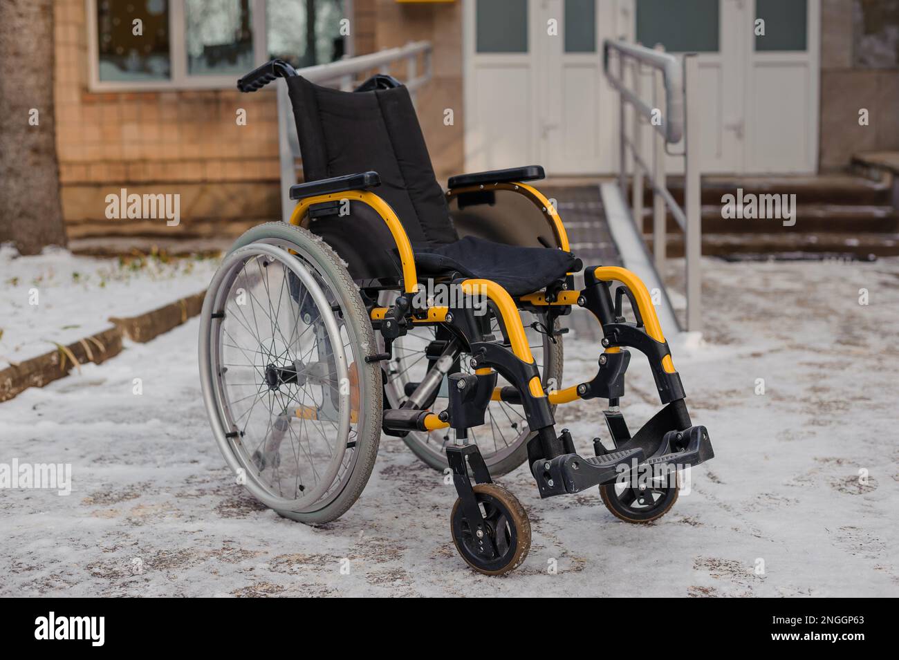 Empty wheelchair in the hospital on the ramp. Wheelchair close-up ...