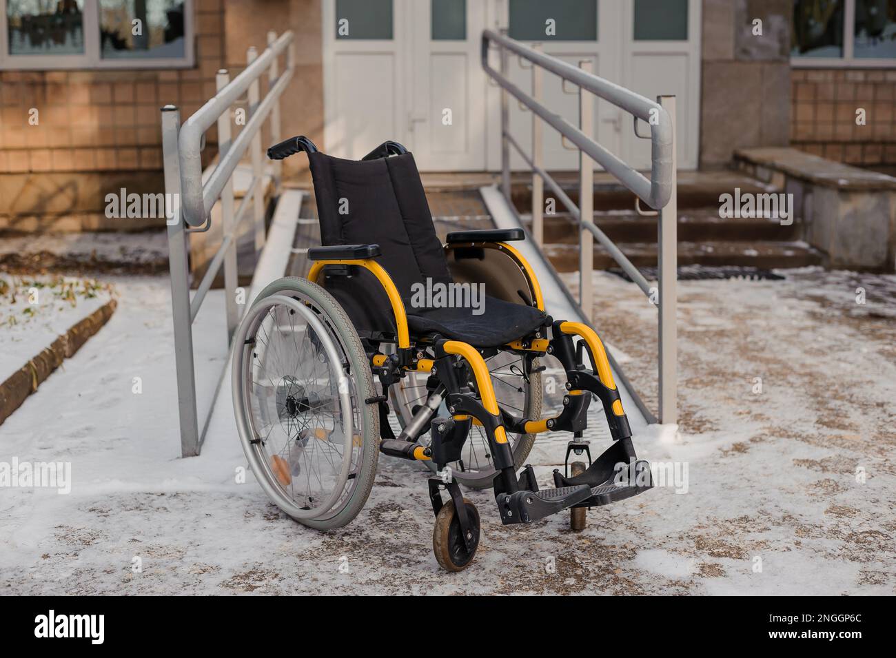 Empty wheelchair in the hospital on the ramp. Wheelchair close-up ...