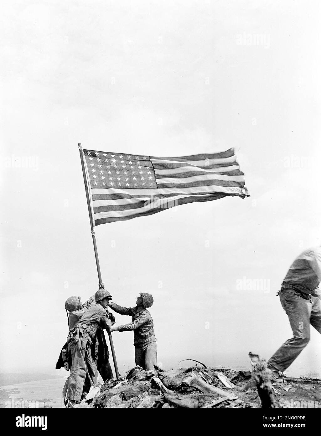 U.S. Marines of the 28th Regiment of the Fifth Division raise the ...