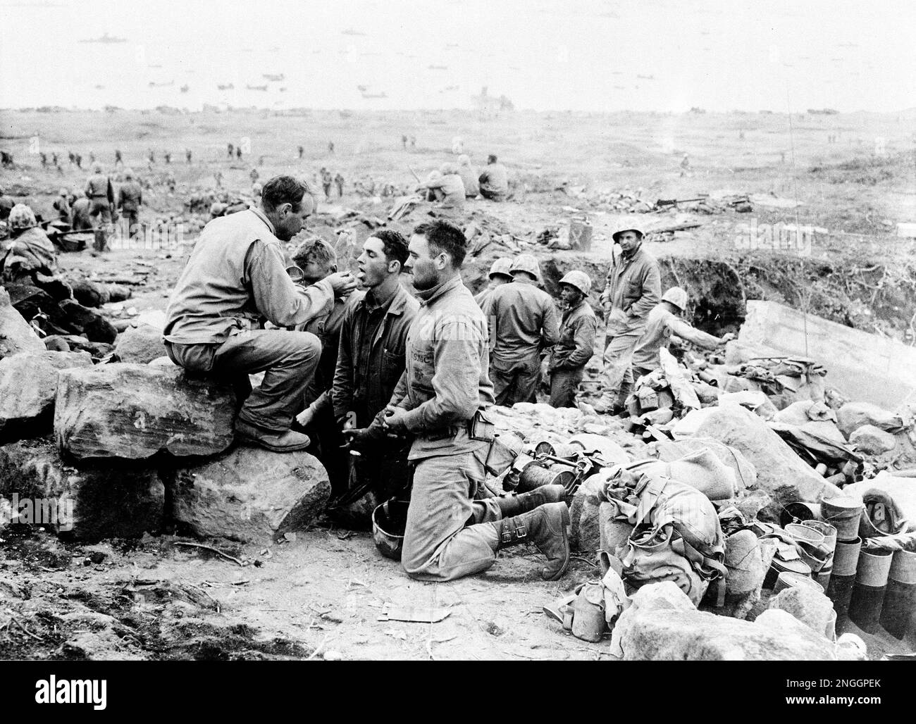 U.S. Marines receive communion from a Marine chaplain on Iwo Jima, the ...