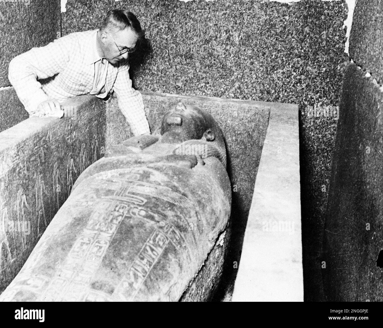 Prof. Pierre Montet of Strasbourg University is shown in the tomb of ...