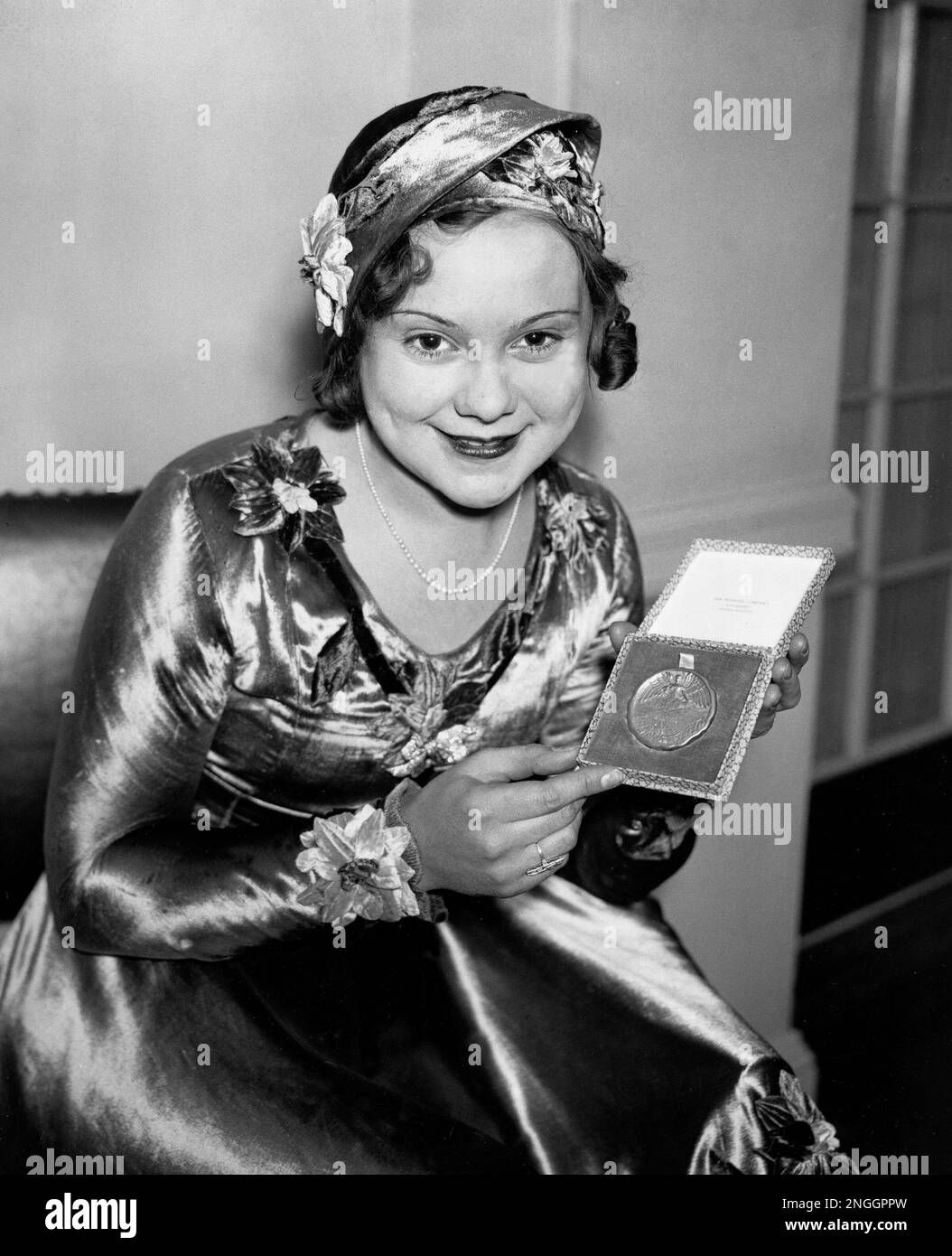 Sonja Henie of Norway, world champion figure skater, poses after ...