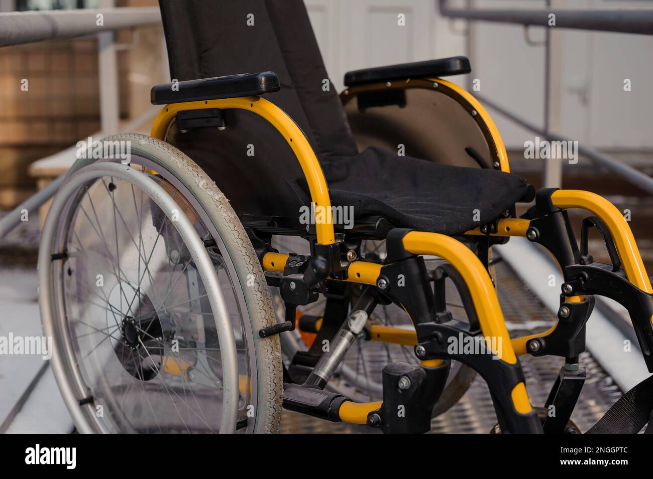 Empty wheelchair in the hospital on the ramp. Wheelchair close-up ...