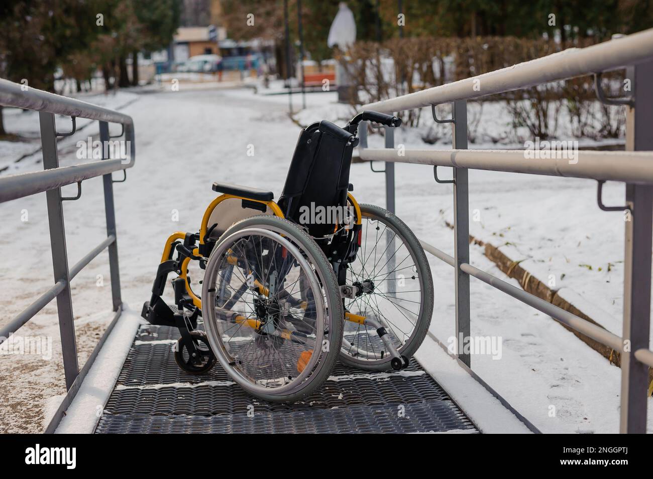 Empty wheelchair in the hospital on the ramp. Wheelchair close-up ...