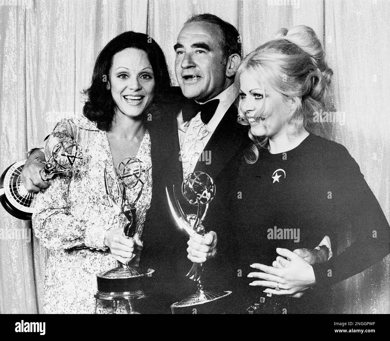 Valerie Harper, left, Ed Asner, center, and Sally Struthers hold their ...