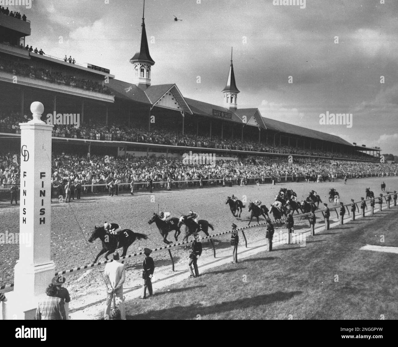 Seattle Slew leads the field toward the finish line to win the 103rd ...