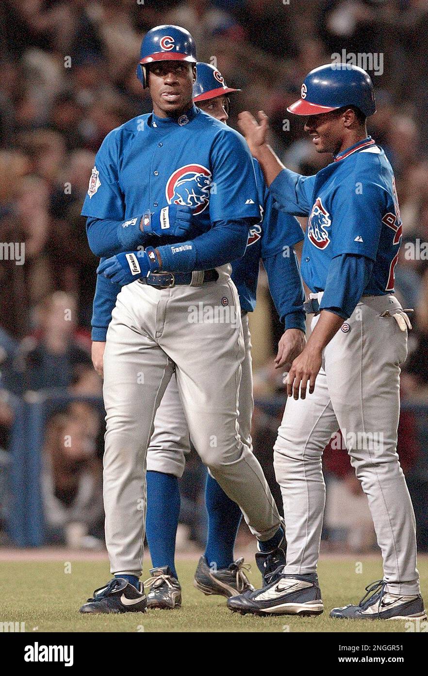 Chicago Cubs' Fred McGriff, left, is congratulated by Corey Patterson ...