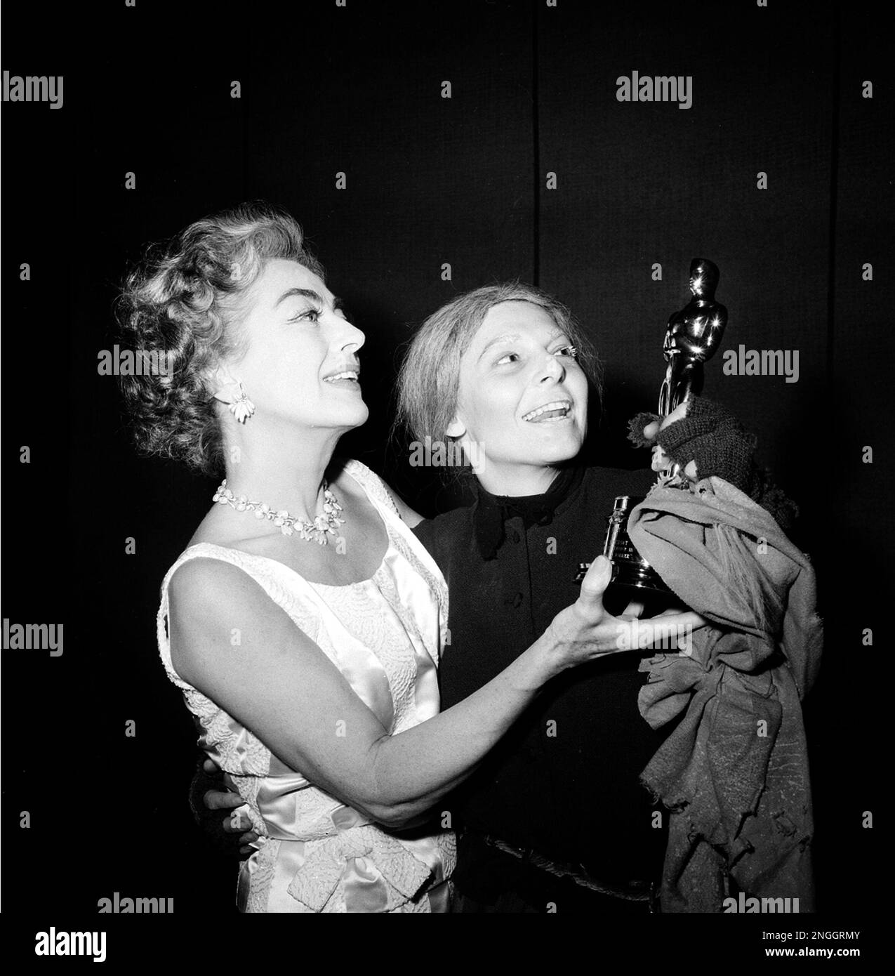 Anne Bancroft, right, is presented the Oscar award from Joan Crawford ...