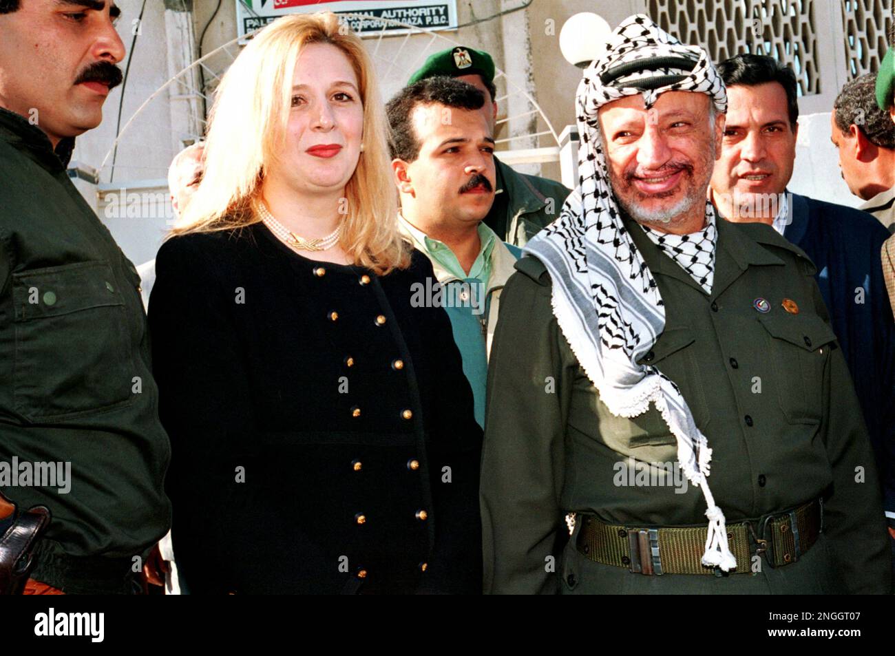Yasser Arafat, chairman of Palestine Liberation Organization, right ...