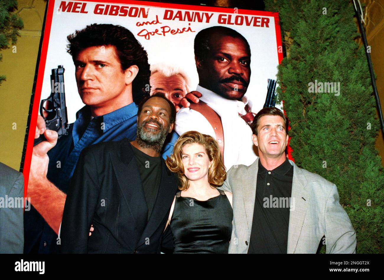 Co-stars Danny Glover, left, Rene Russo, center, and Mel Gibson pose in front of a "Lethal ...