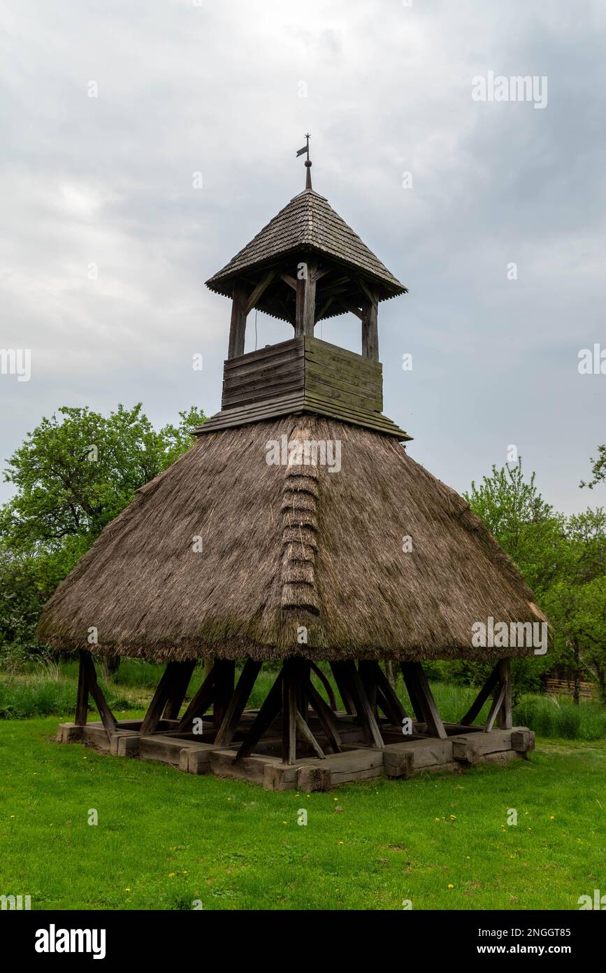 Old wooden bell tower with thatched roof. The region's symbolic ...