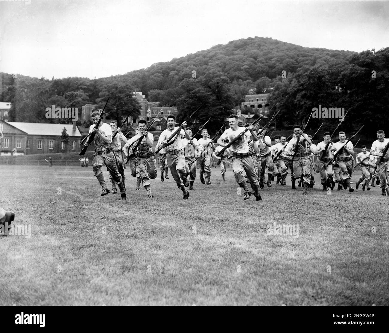 Plebes of the United States Military Academy charge across an open ...