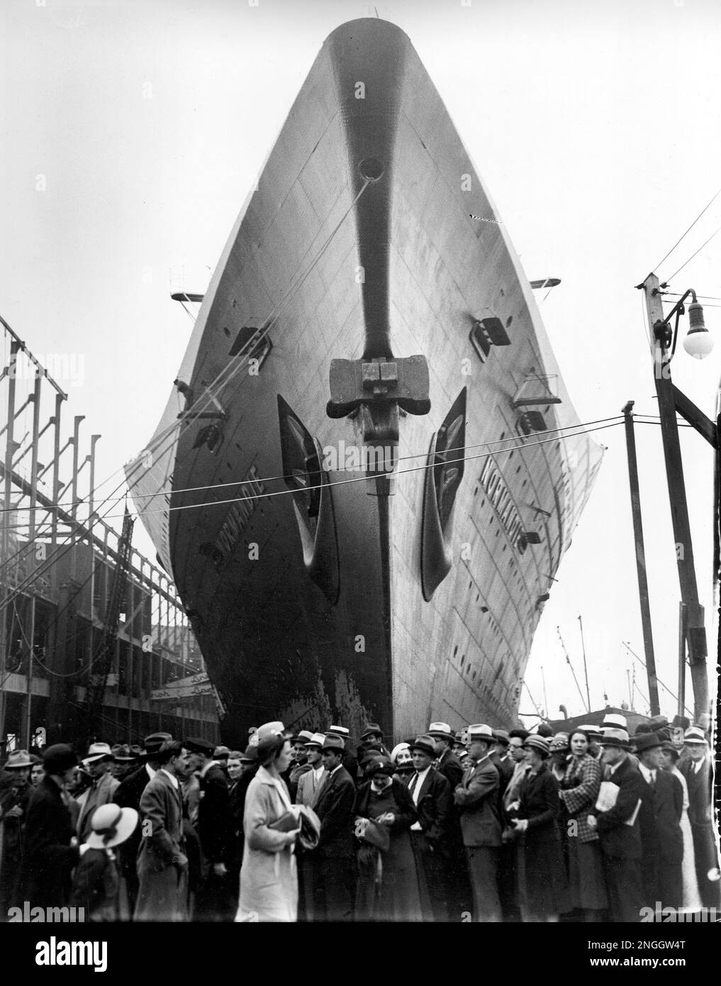 Spectators gather to view the luxury French ocean liner Normandie as ...