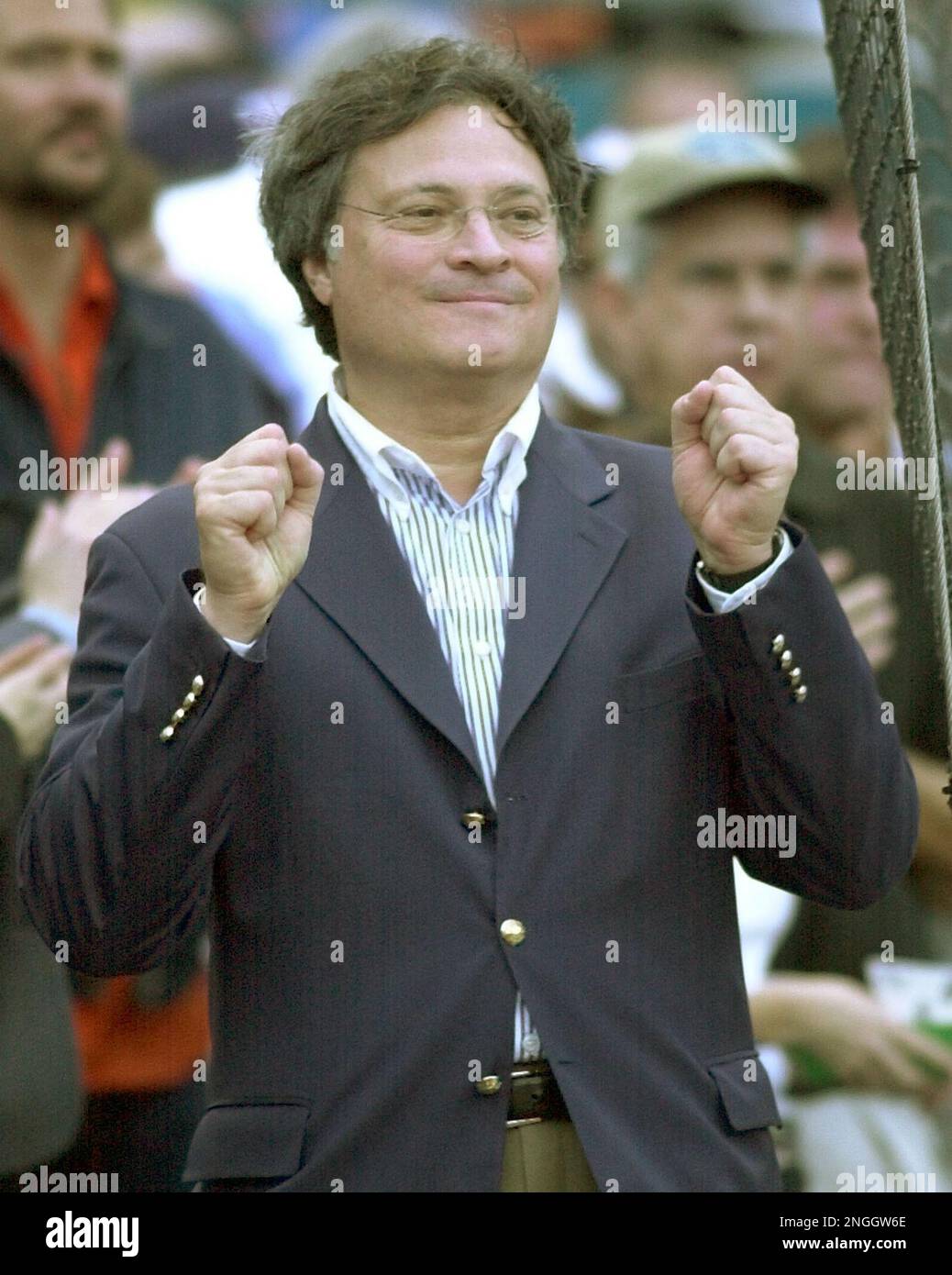 Florida Marlins' owner Jeffrey Loria cheers on as players are announced ...