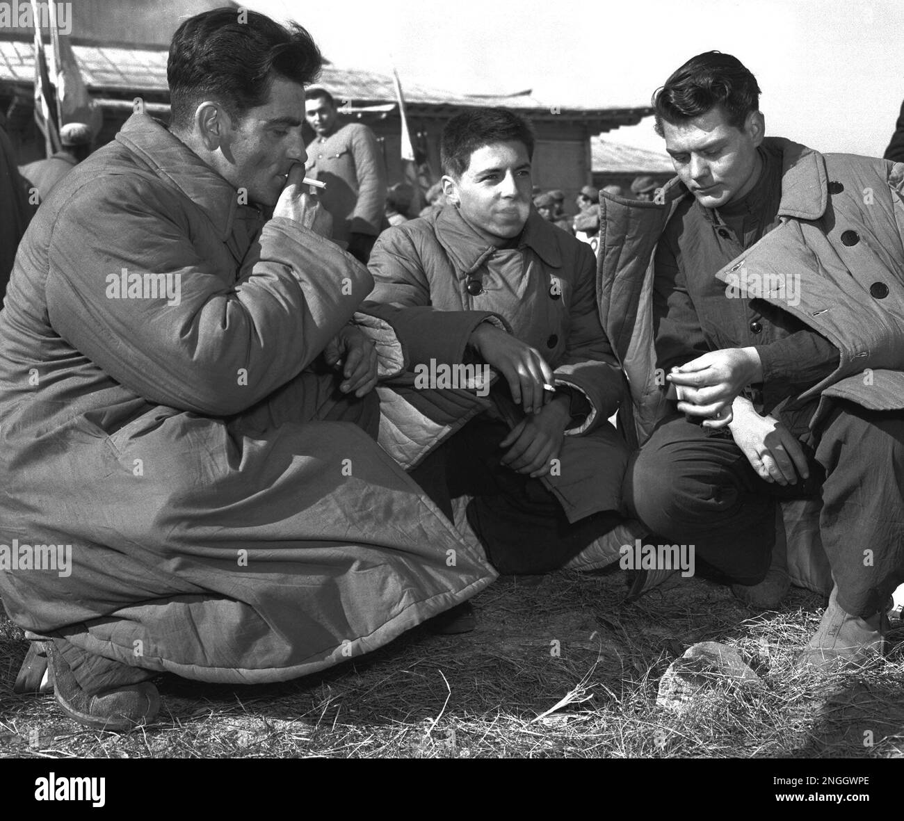 Three Americans who refused repatriation, take a smoke break outside ...