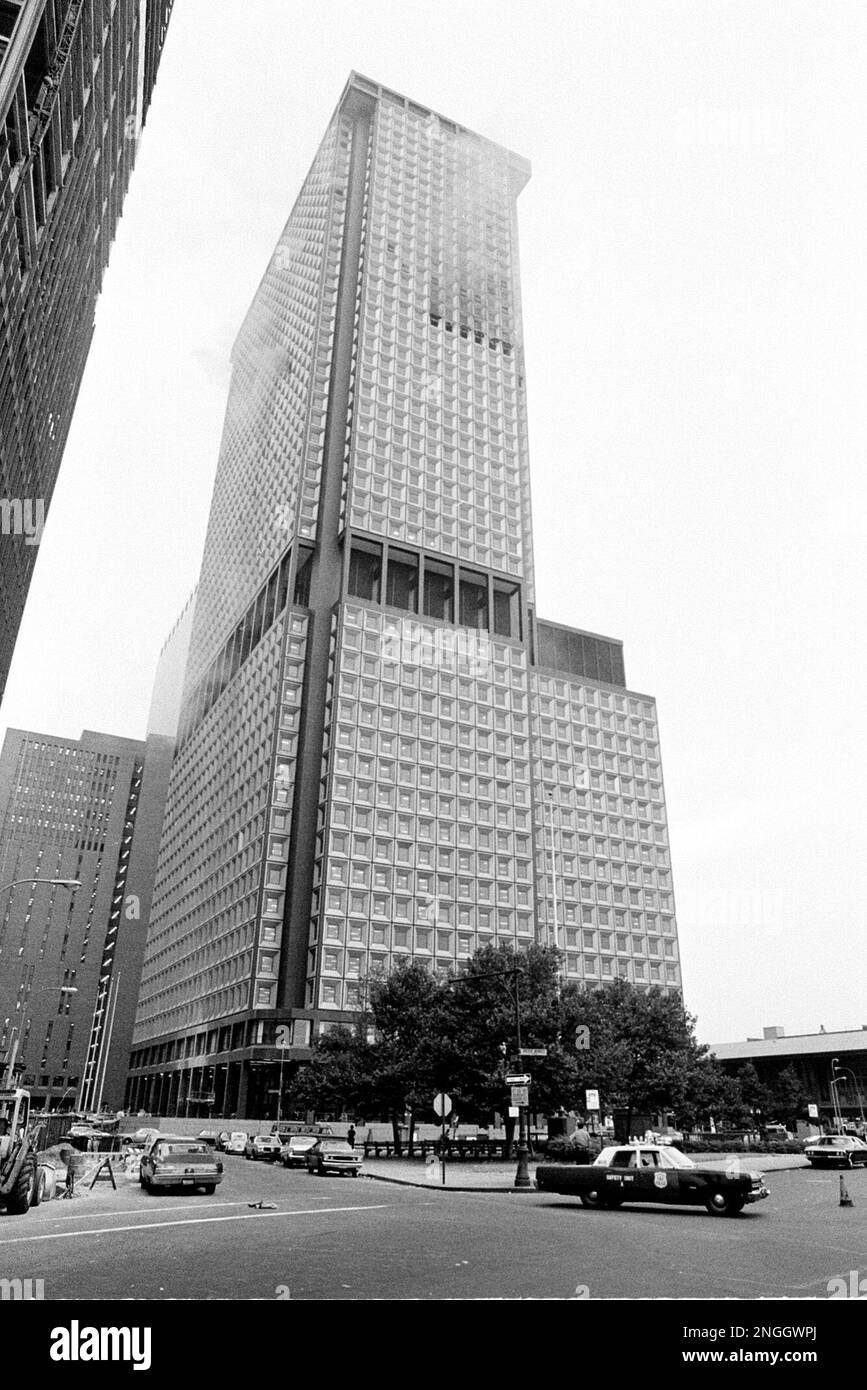 Smoke drifts from windows of 33rd floor of One New York Plaza building ...