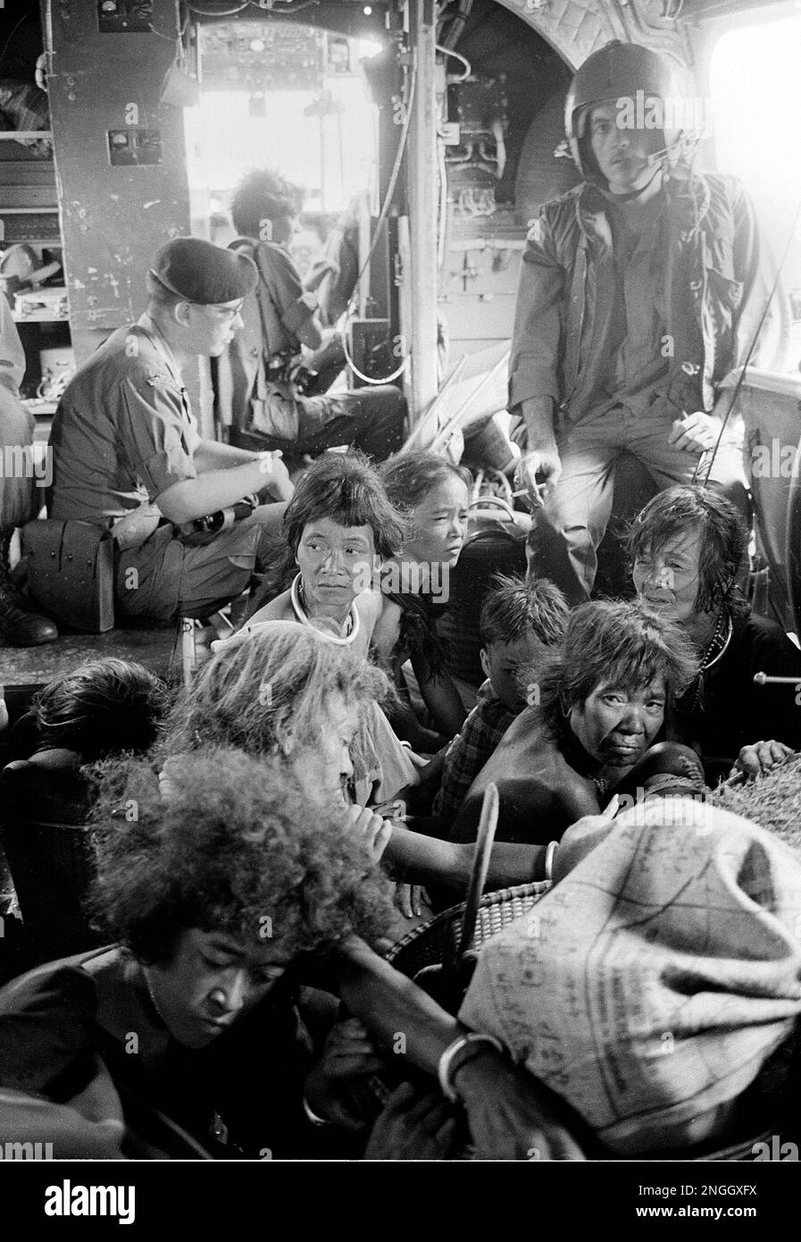 Members of the Montagnard tribe sit on the floor of an American ...