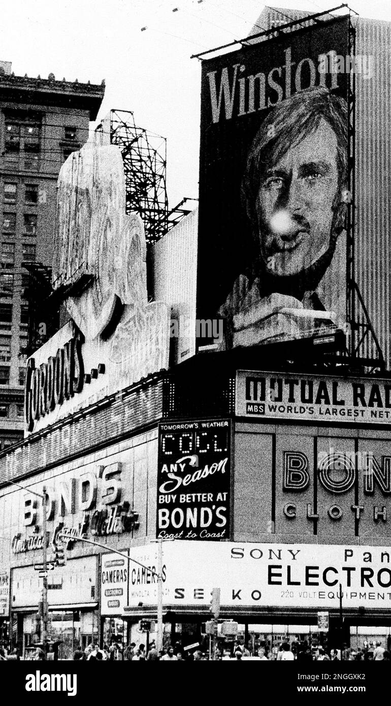 A Winston cigarette advertisement of a man blowing a smoke ring is ...