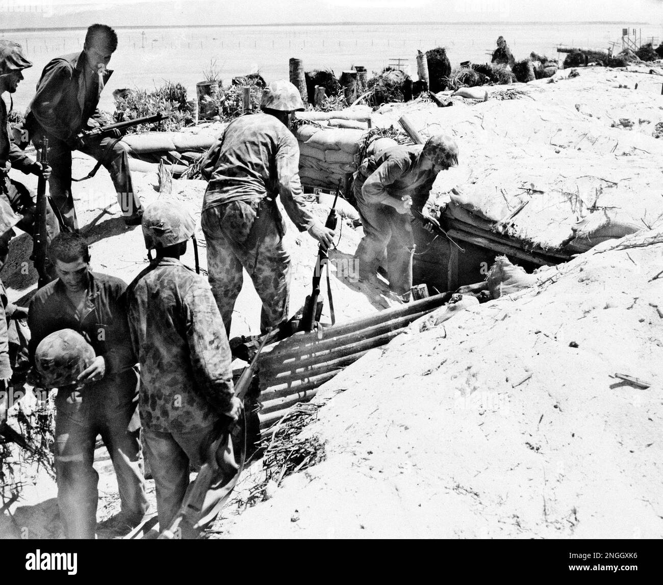 U.S. Marines order Japanese soldiers to surrender from the bombproof ...
