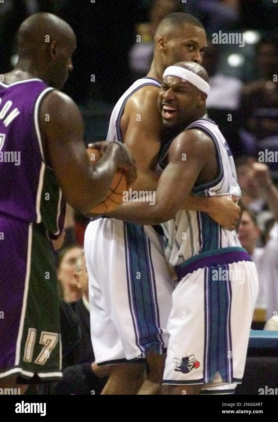 Charlotte Hornets' Baron Davis, right, celebrates with teammate P.J ...