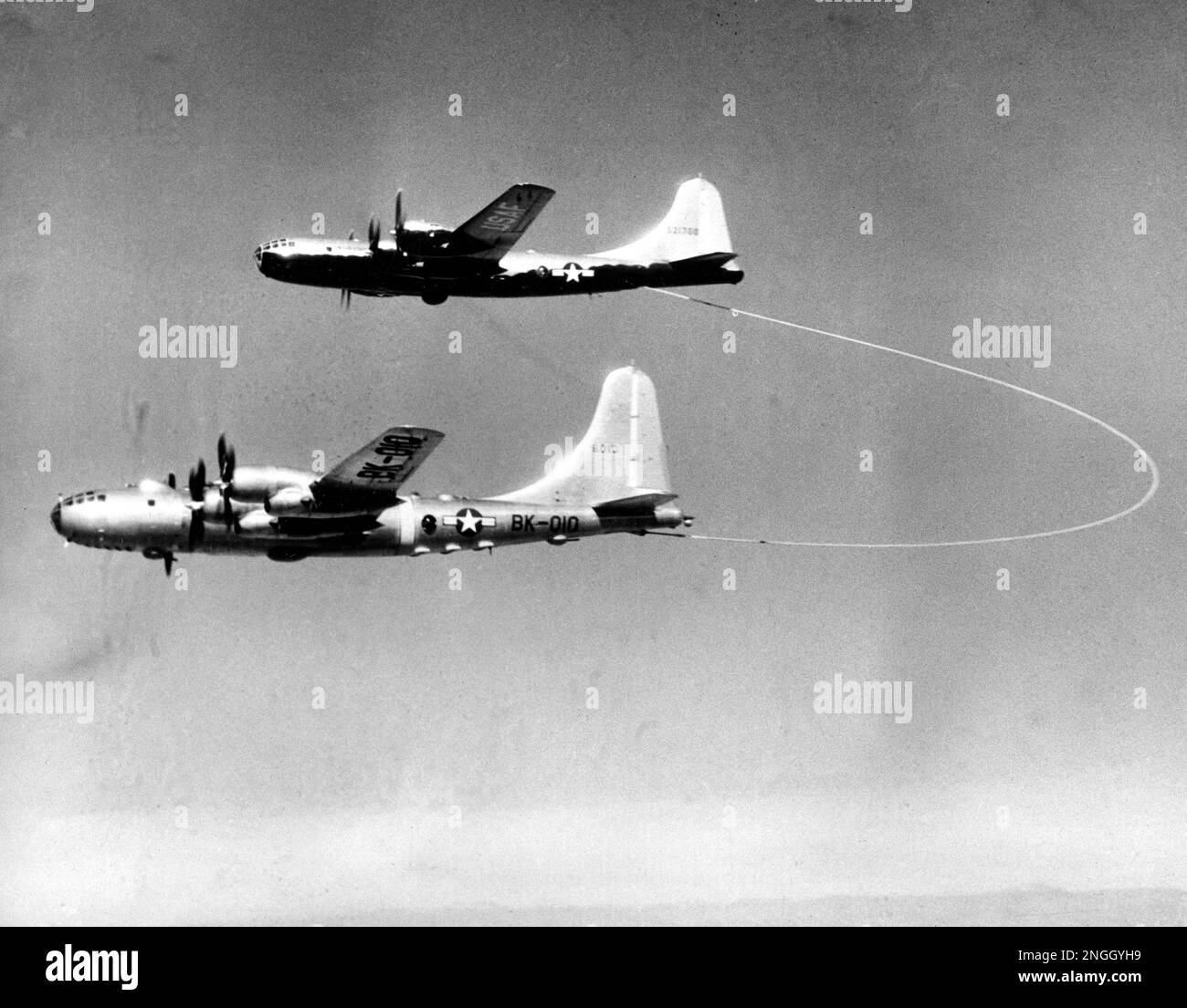 A B-29 tanker plane, top, refuels the B-50 bomber "Lucky Lady II" in ...