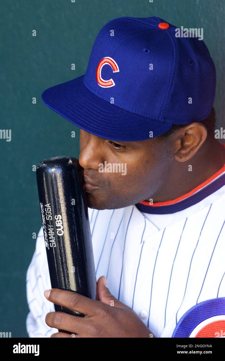 Chicago Cubs' Sammy Sosa kisses his bat during a dugout photo session ...