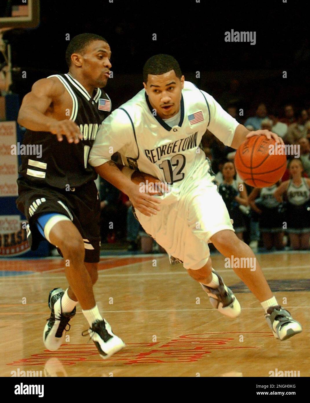 Georgetown's Kevin Braswell (12) drives past Providence's John Linehan ...