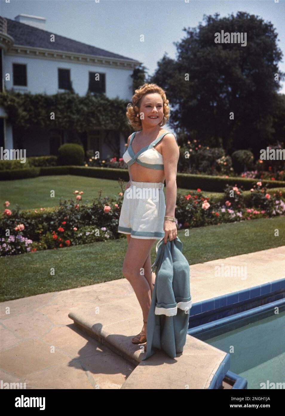 Sonja Henie is seen at her home in California modeling a summer outfit ...