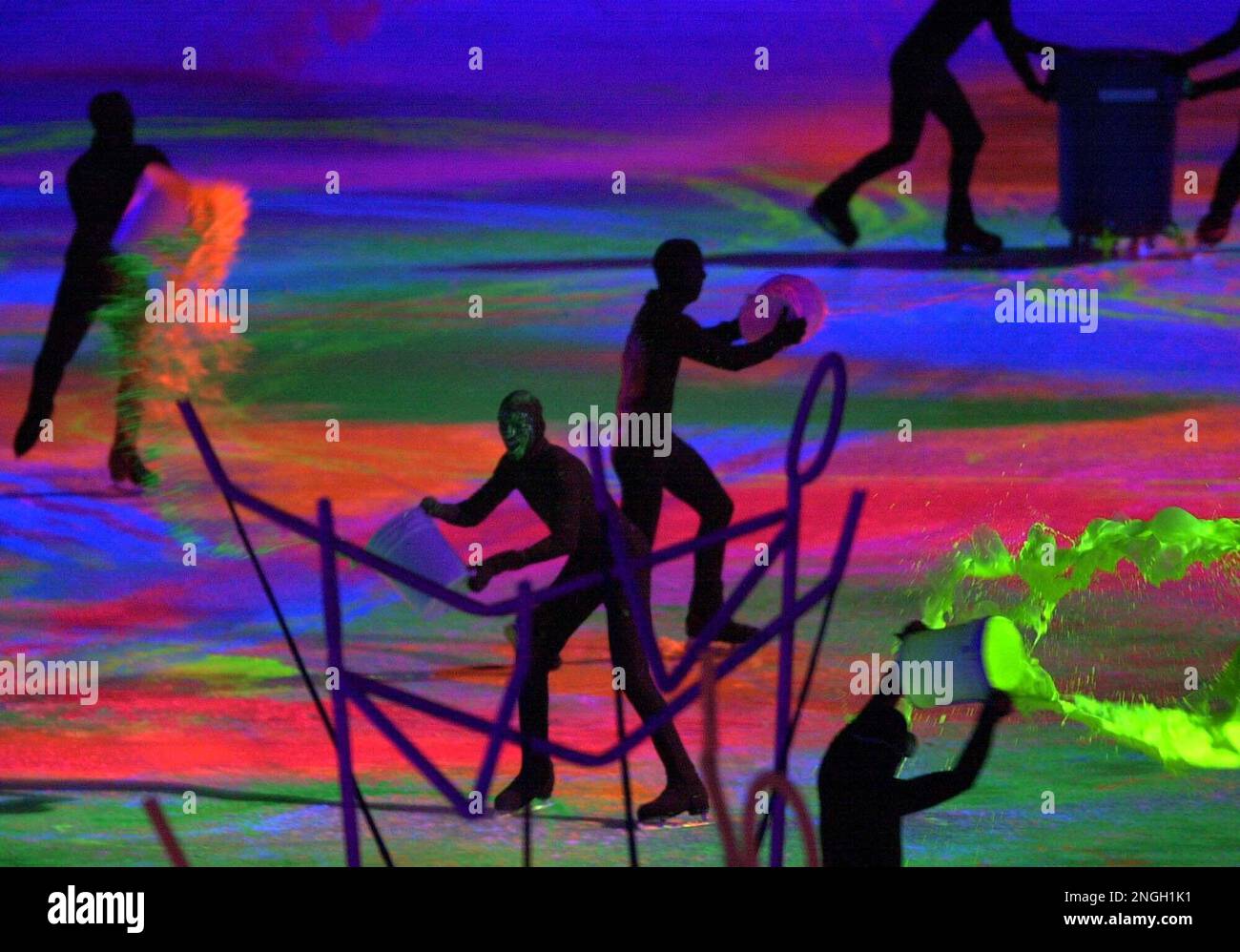 Skaters pour ultra-violet paint over the ice and create a contemporary ...