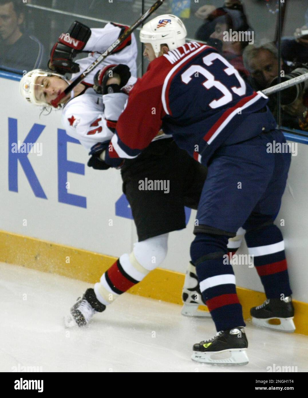 Canada's Ryan Smyth, left, is checked by USA's Aaron Miller during ...