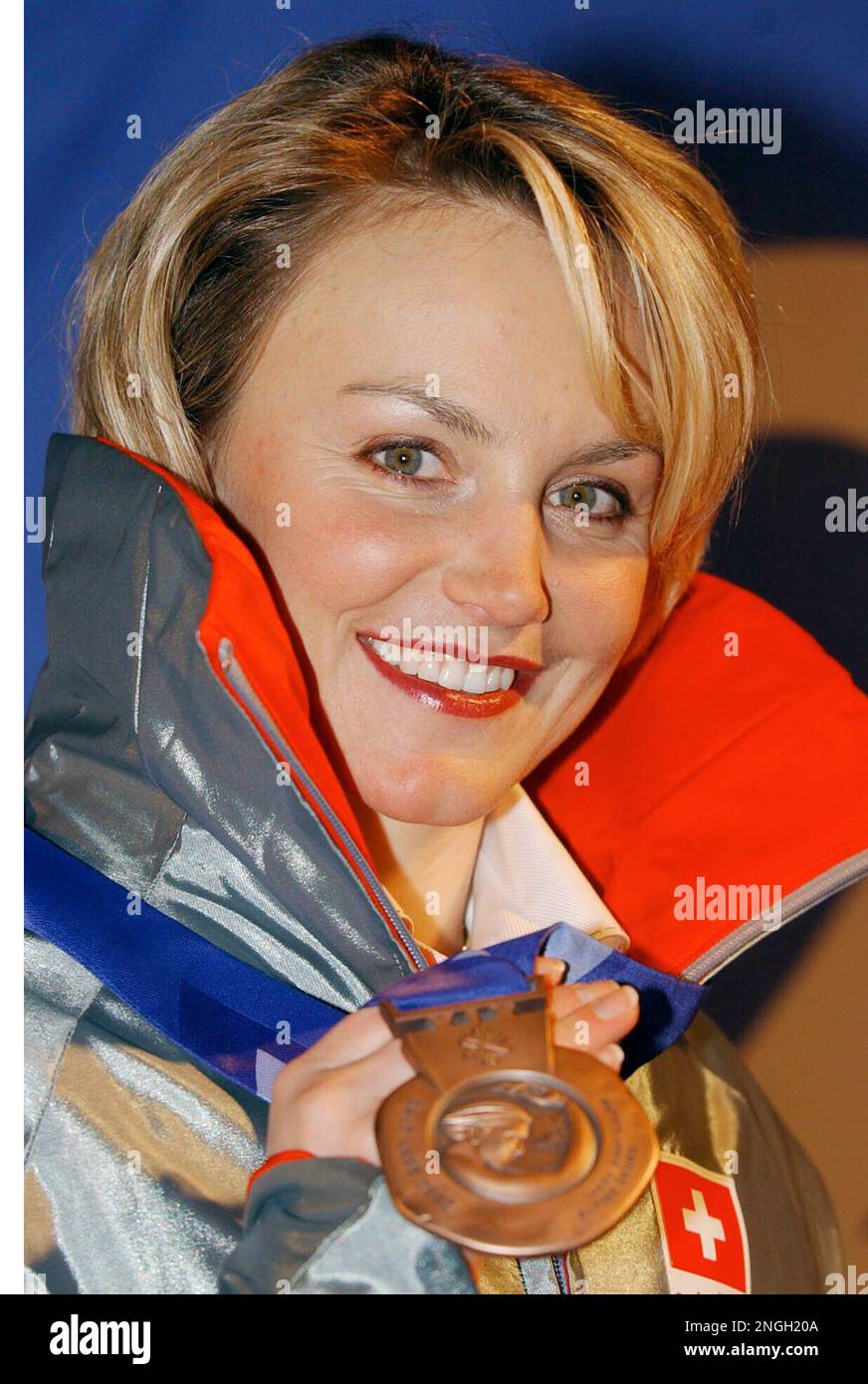 Sonja Nef of Switzerland shows off the bronze medal she won in the ...