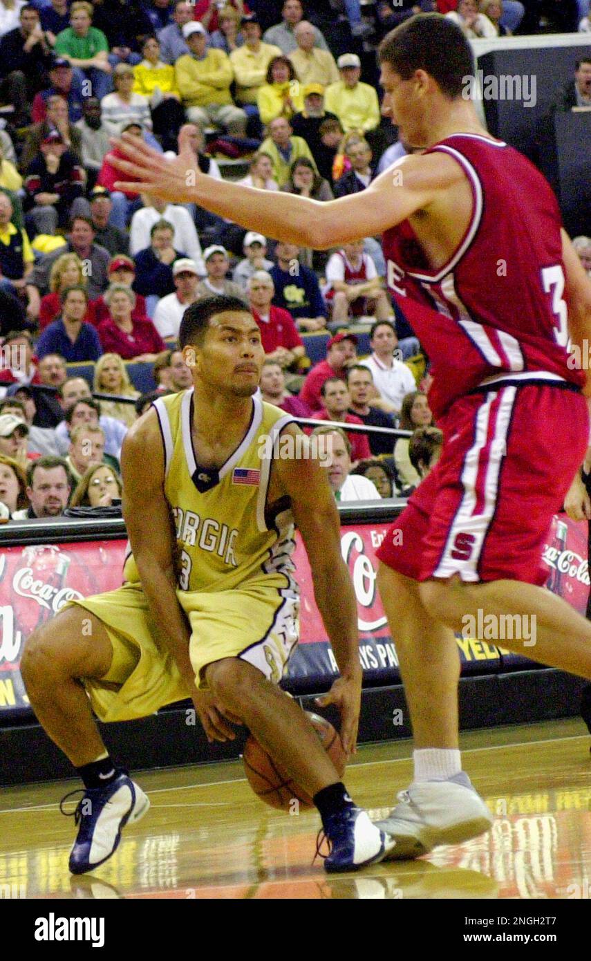 Georgia Tech's Tony Akins (3) looks for a way around North Carolina ...