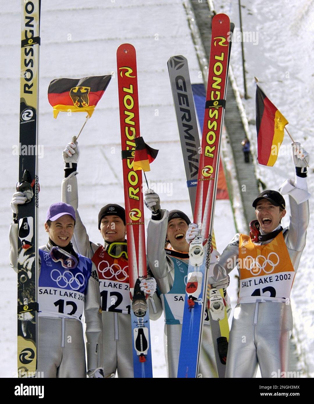 The German team celebrate their gold medal during the flower ceremony ...