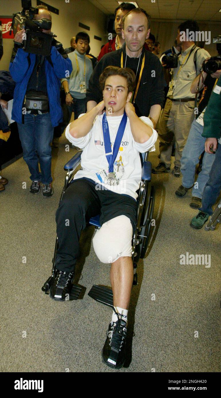 Wearing his silver medal, Apolo Anton Ohno of the United States leaves ...
