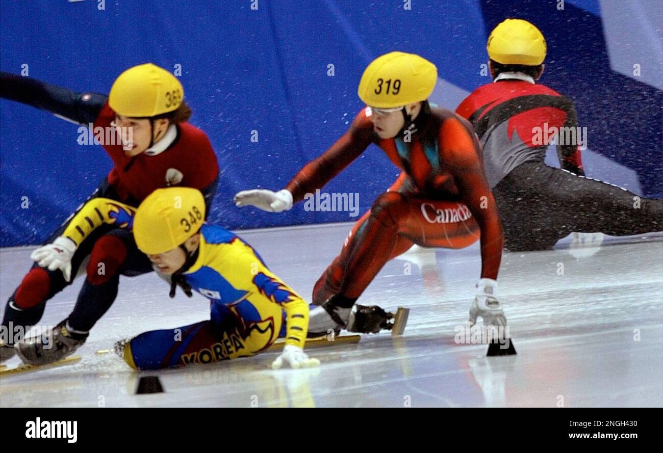 Apolo Anton Ohno of the United States collides with Korea's Ahn Hyun ...
