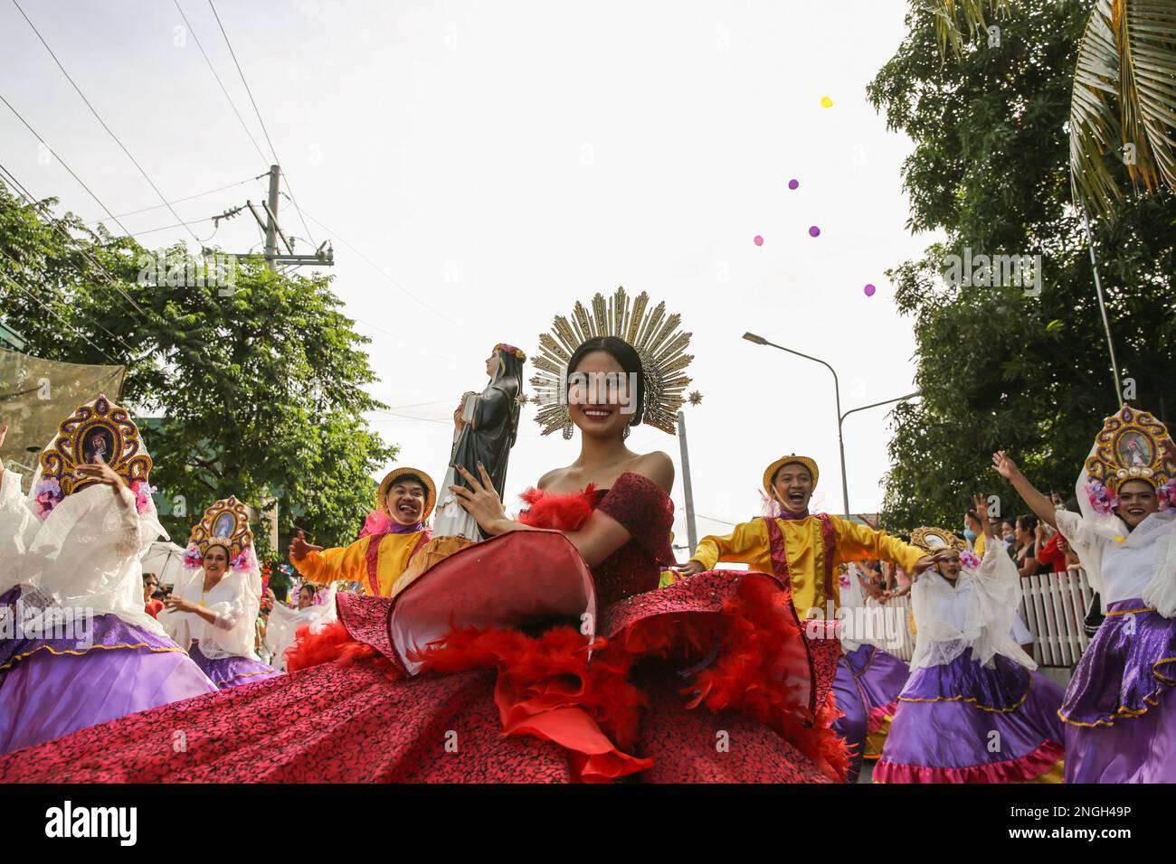 Manila, Philippines. 18th Feb, 2023. A performer holding an image of St. Rose of Lima dance on ...