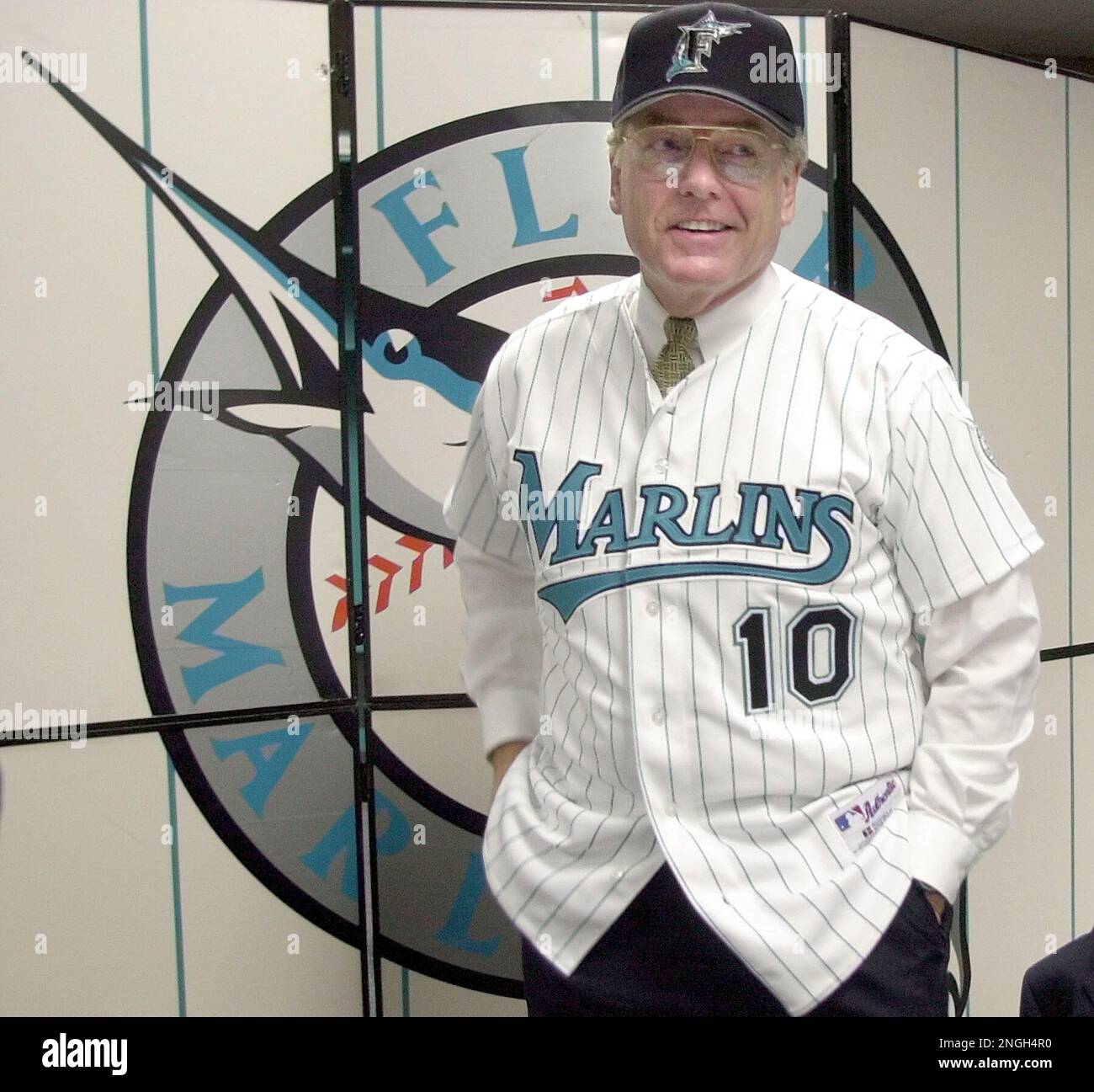 Jeff Torborg, the new Florida Marlins manager, shows off his jersey and ...