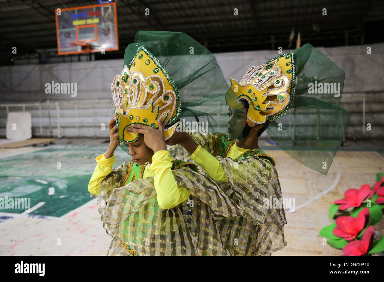 Manila, Philippines. 18th Feb, 2023. A performer helps his groupmate ...