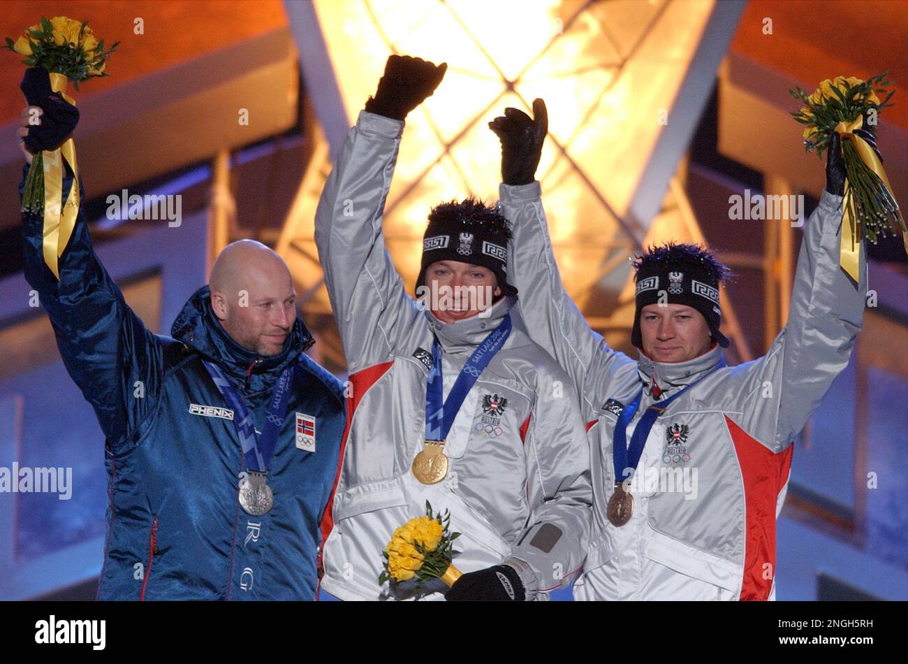 Men's downhill gold medalist Fritz Strobl of Austria, center, is ...