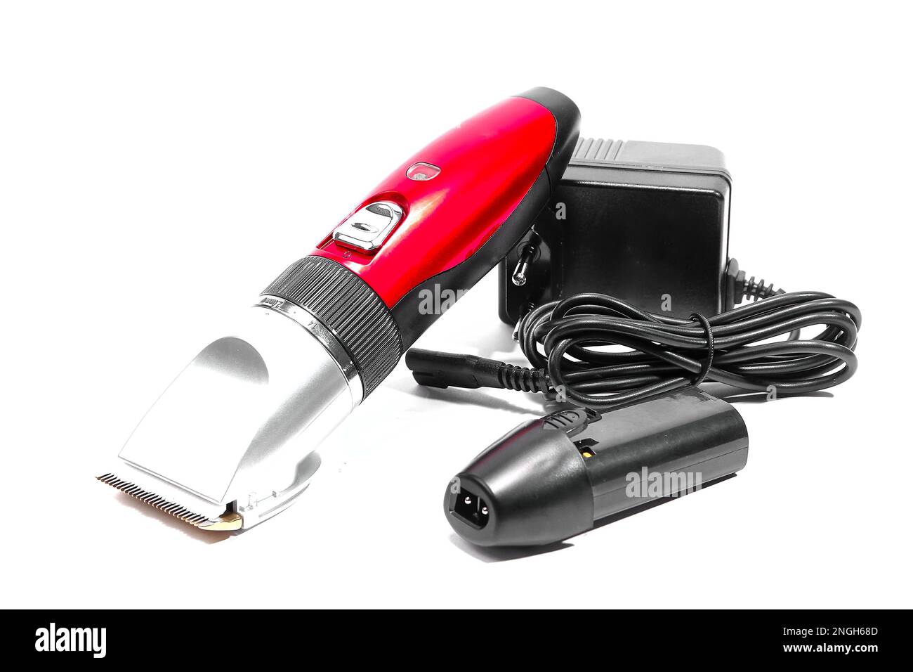 Hair clipper, extra battery, charger on white background Stock Photo ...