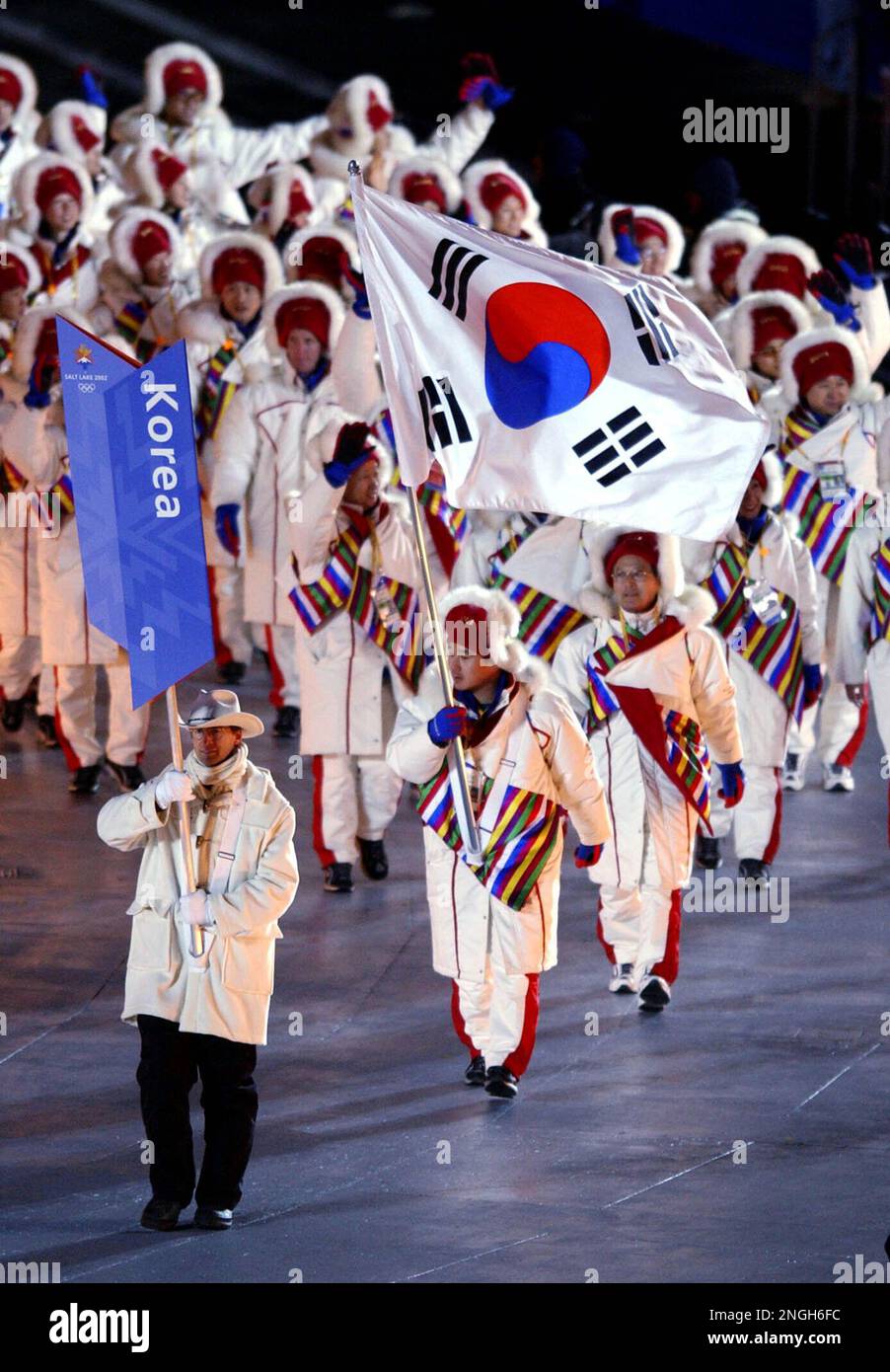 Team Korea, led by flag bearer alpine skier Seung-Wook Hur, enters the ...