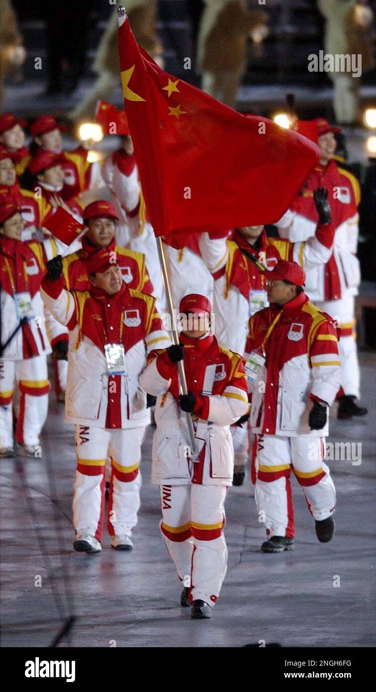 The Chinese Olympic team parades into Rice-Eccles Olympic Stadium ...