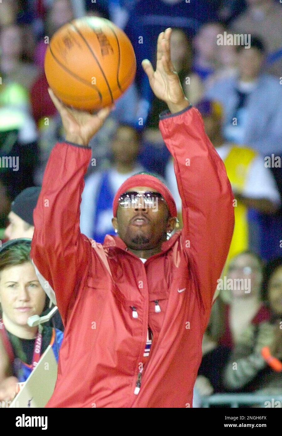 Rapper Sean "P. Diddy" Combs lets go a jump shot during warmups for an ...