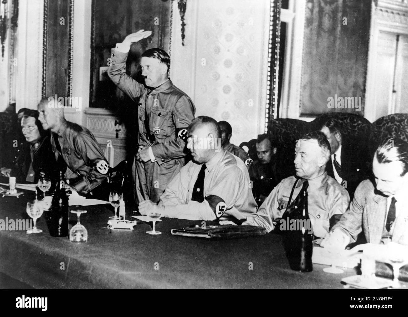 National Socialist Party leader Adolf Hitler raises his right hand in ...