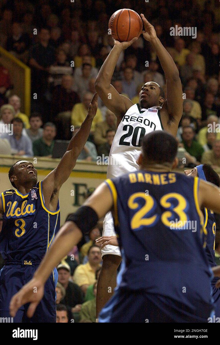 Oregon's Frederick Jones scores against UCLA's Billy Knight, left, and ...