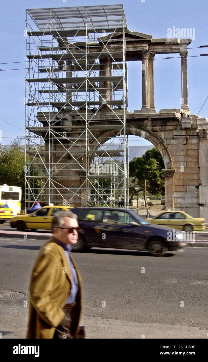 Scaffolding covers half of Hadrian's Arch during restoration in Athens ...