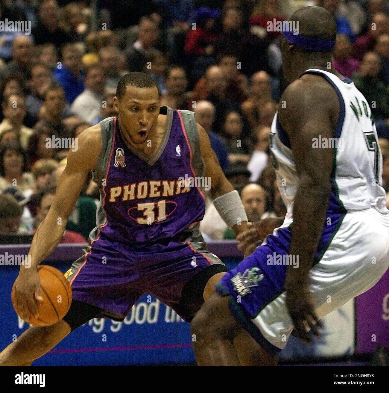 Phoenix Suns' Shawn Marion (31) tries to make a move on Milwaukee Bucks ...