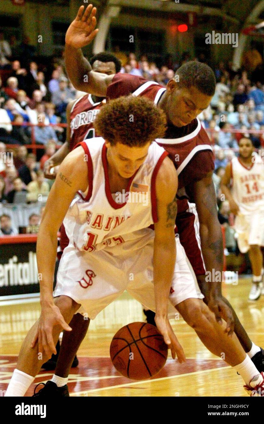 St. Joseph's' Delonte West, foreground, and Fordham's William Parker go ...